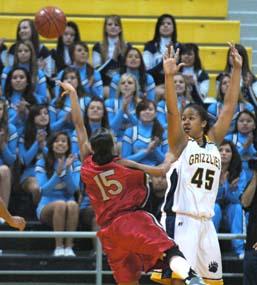 Chloe Wells puts up a shot in front of Los Osos cheer squad. | Sports ...
