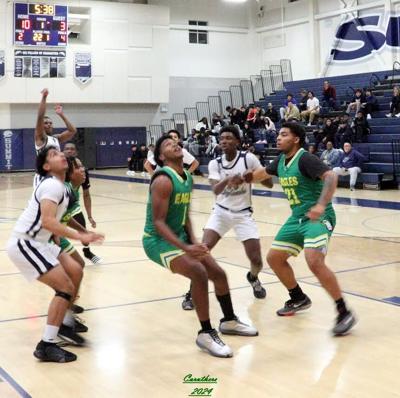 Summit basketball team conquers Ike to hold on to first place in league ...