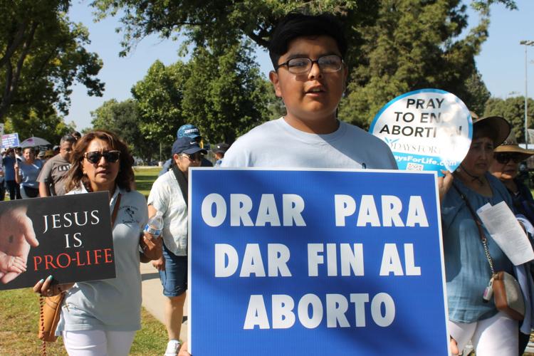 Hundreds march in opposition to proposed Planned Parenthood facility in ...