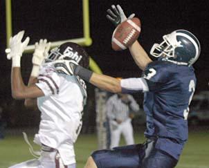 Brandon Barbee (front) breaks up a pass in the end zone. | Sports ...