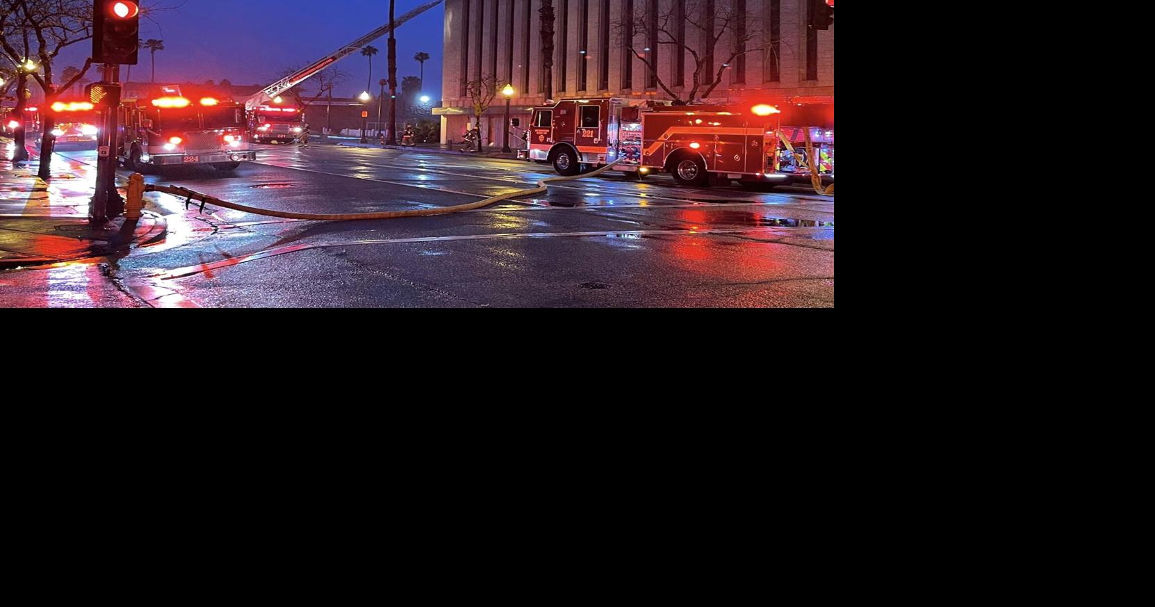 Firefighters rescue two people after fire damages vacant building in ...