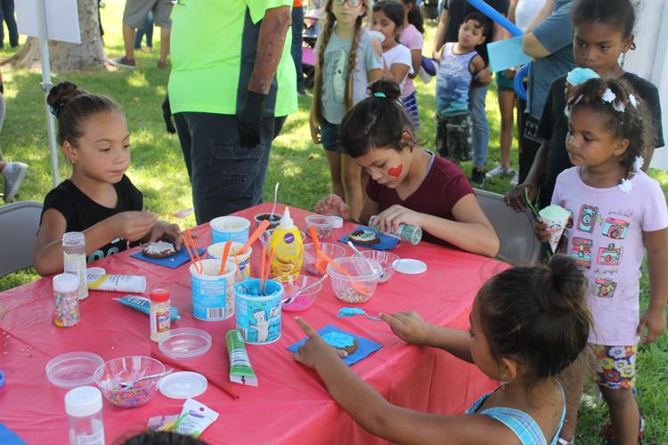 Hundreds of students receive free backpacks and shoes during event at ...