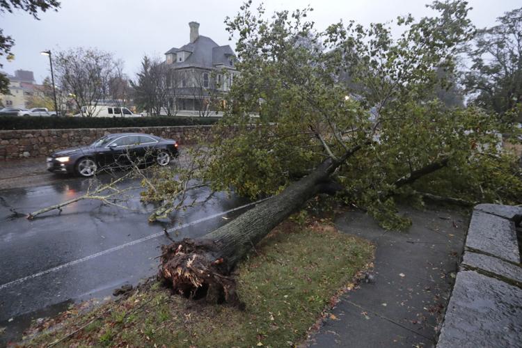 Photos: New England surveys damage in Nor'easter's aftermath ...