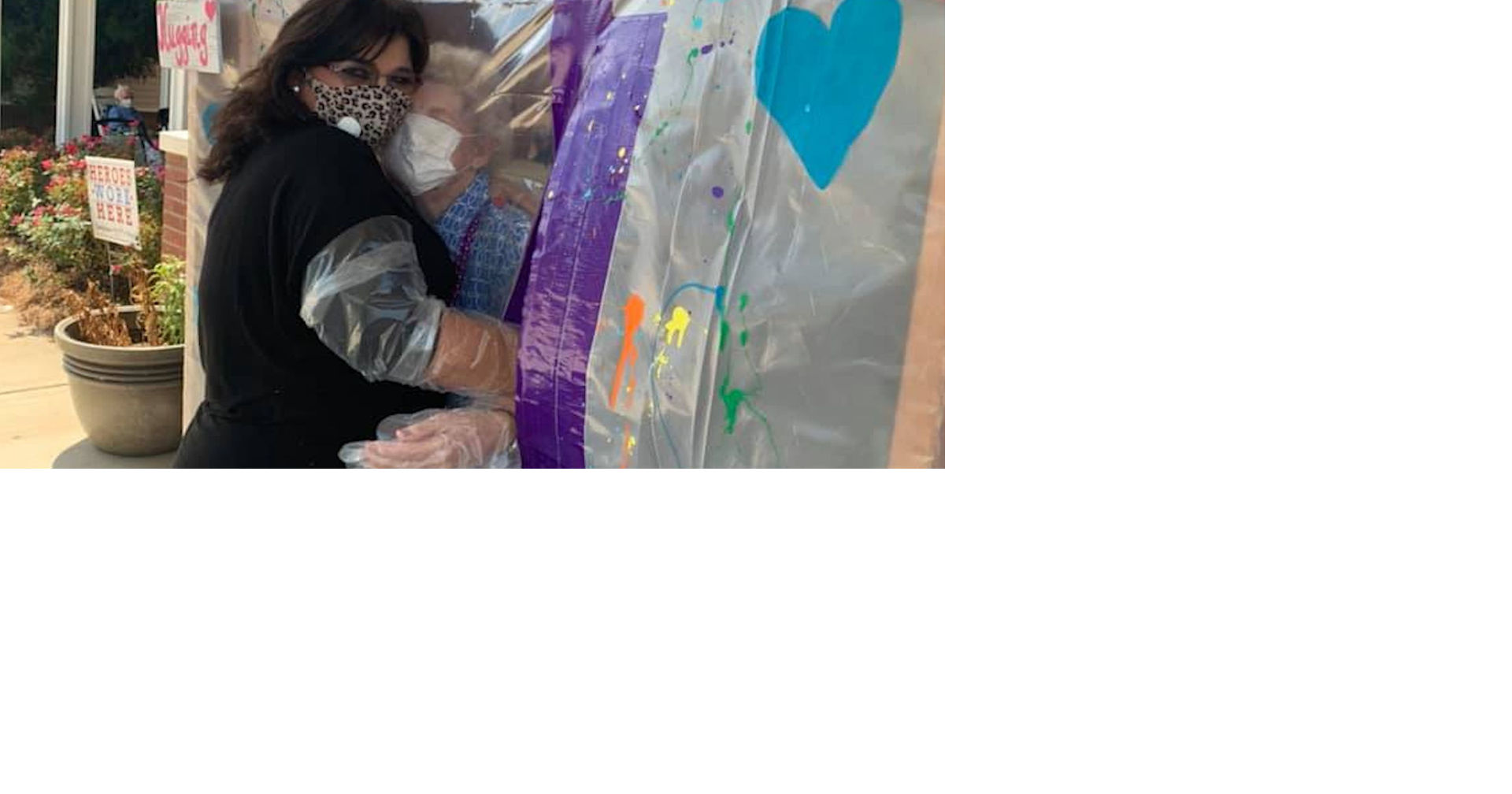 Nursing home installs hugging booth so visitors can hold their loved ...