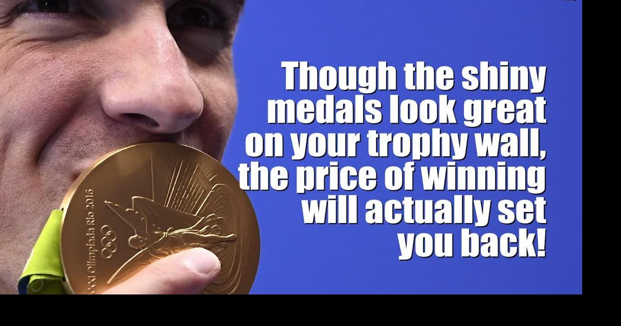 Why do Olympic winners bite their medals? | Trending | fox13memphis.com