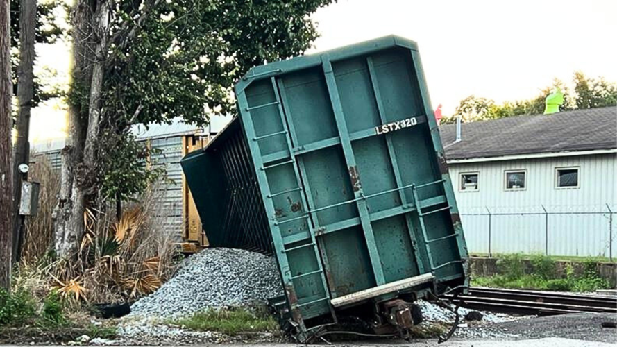 PHOTOS: Train's derailment leaves boxcars off the tracks, blocks ...