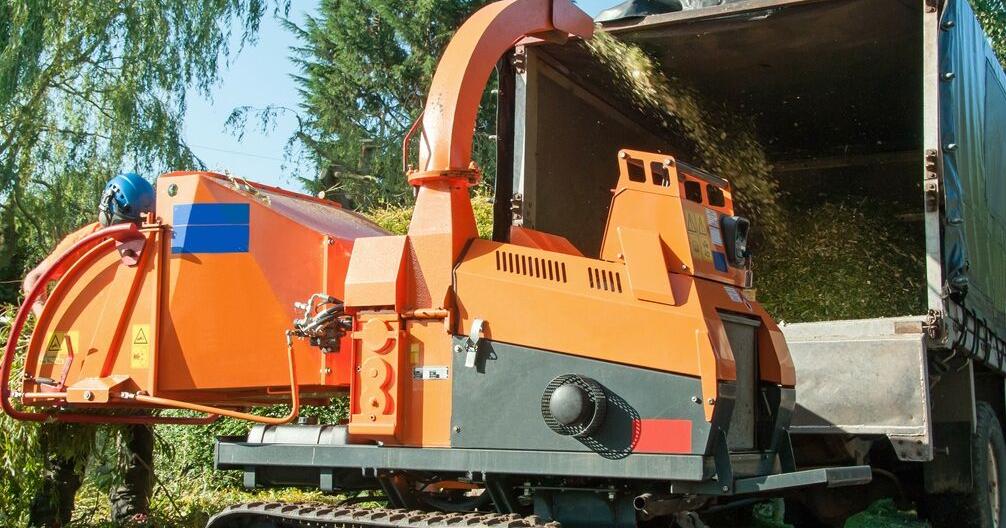 Officials: Tree trimmer dies after falling into wood chipper in ...