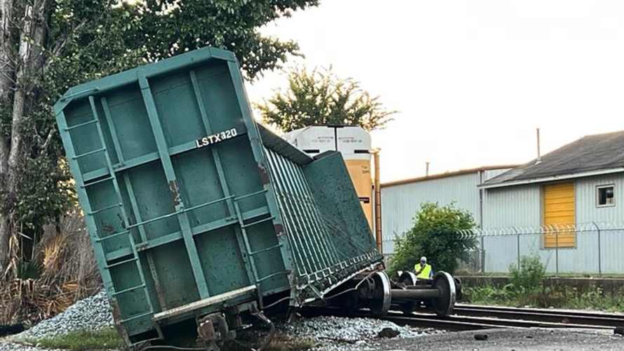 PHOTOS: Train's derailment leaves boxcars off the tracks, blocks ...