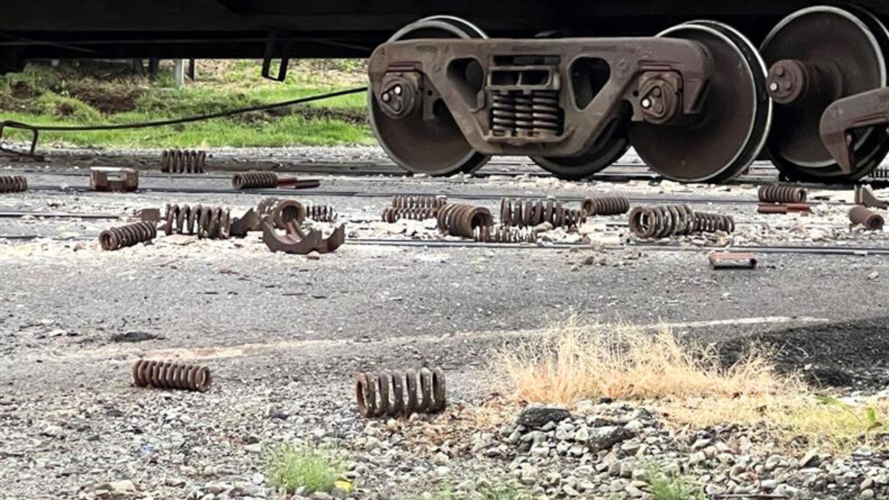 PHOTOS: Train's derailment leaves boxcars off the tracks, blocks ...