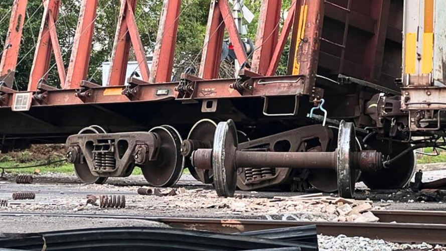 PHOTOS: Train's derailment leaves boxcars off the tracks, blocks ...