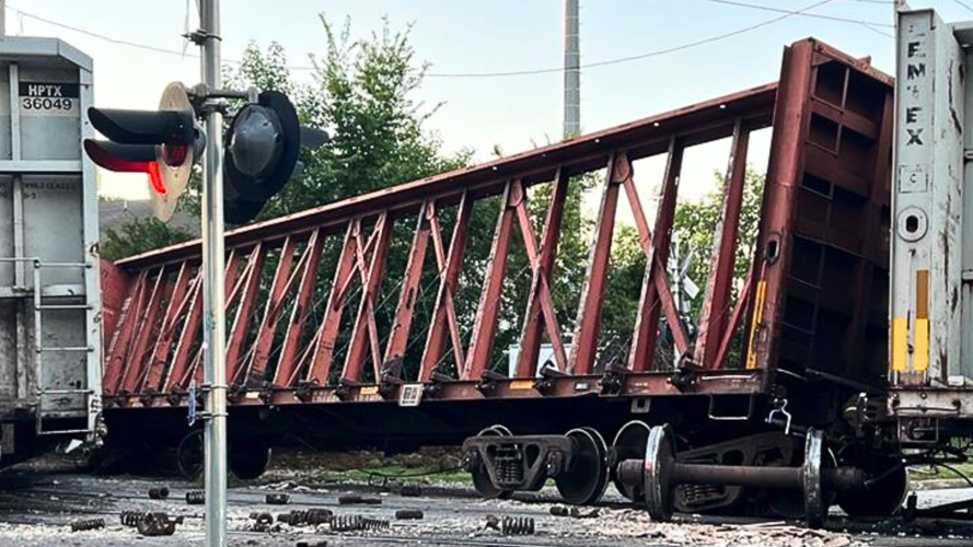 PHOTOS: Train's derailment leaves boxcars off the tracks, blocks ...