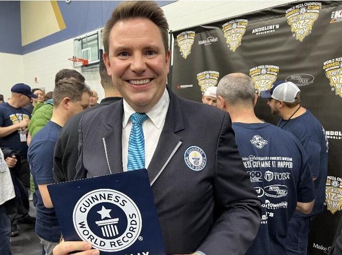 Photos: World record for largest pizza party set at TU basketball game ...