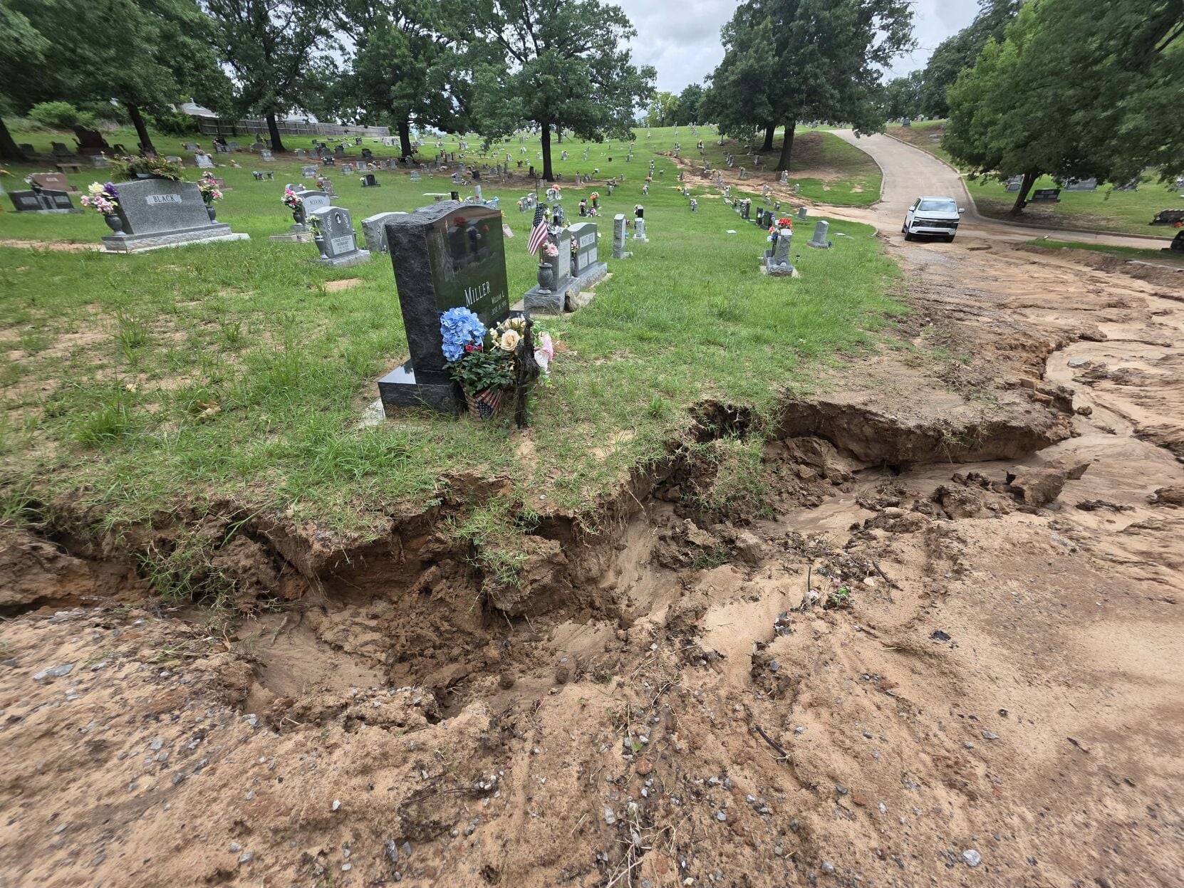 Heavy rains damage section of Sand Springs cemetery | News | fox23.com