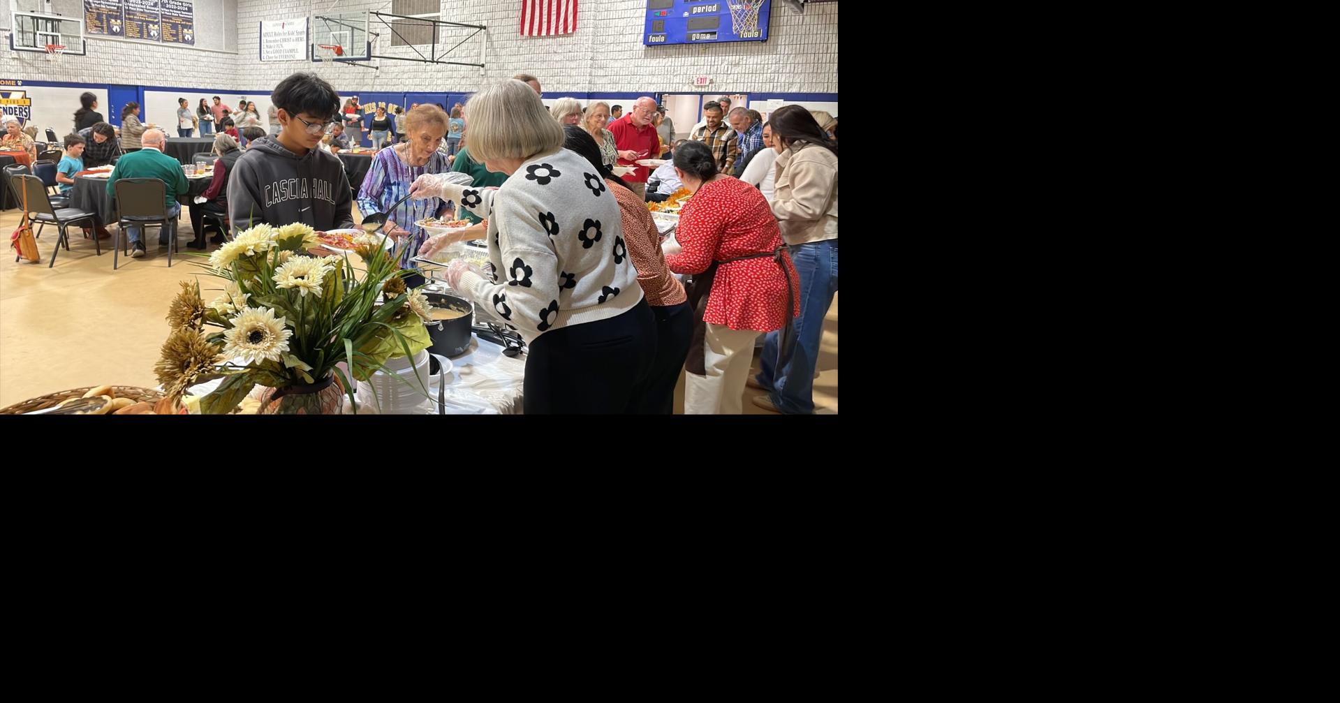 Local Catholic church hosts Thanksgiving dinner event featuring dishes from around the world ...