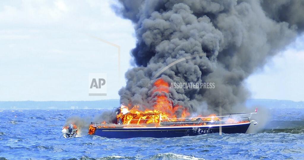 Two boaters jump overboard after yacht catches fire | Local News ...