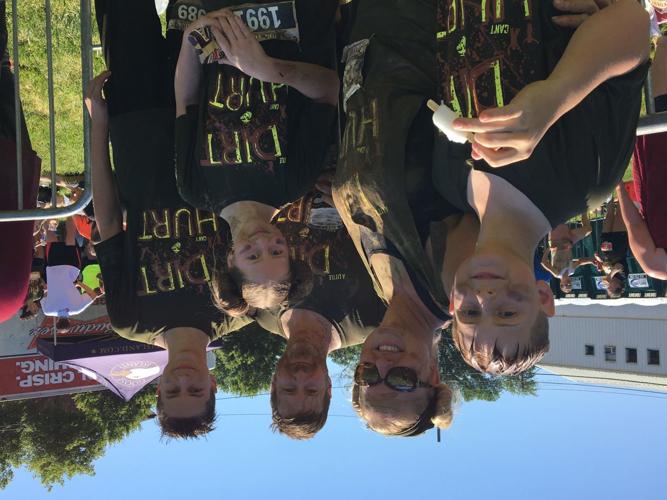 Families enjoy mud and obstacles at Run Amuck race