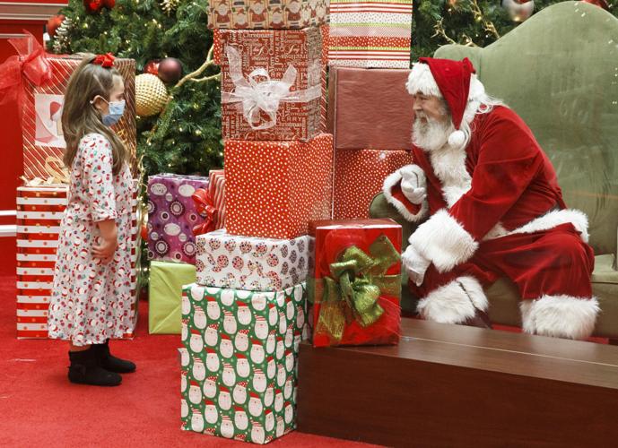 Santas find ways to spread cheer, stay safe during the pandemic