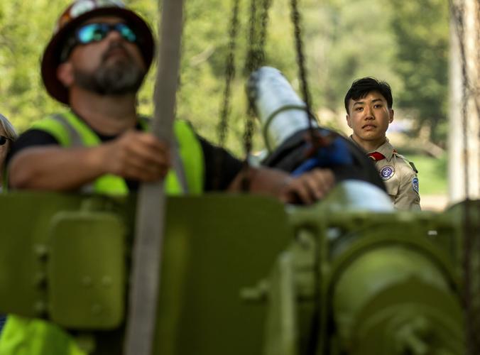 Spectators watch a cannon fly at city VFW post