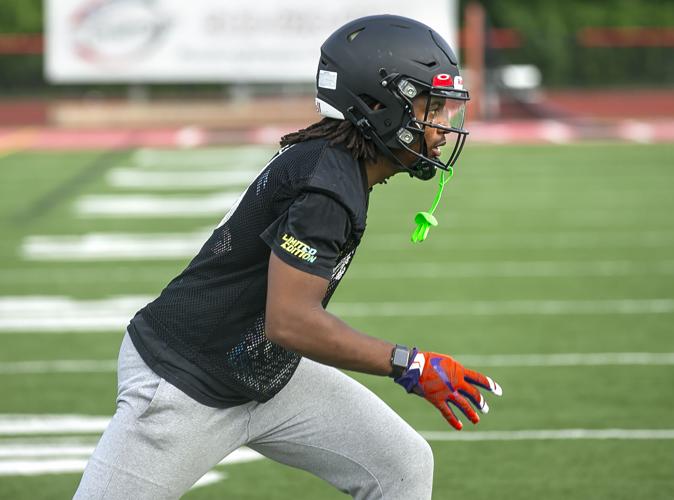 High school football teams open practice in the heat