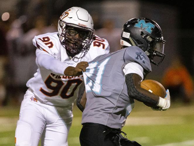 High school football: Daniels shares the spoils with teammates as ...