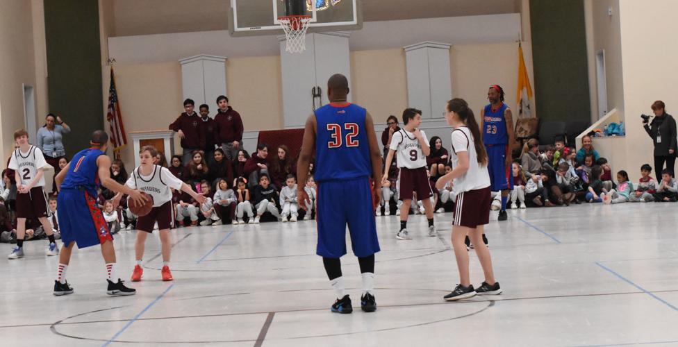 HOLY CROSS: Crusaders welcome the Harlem Rockets to their court