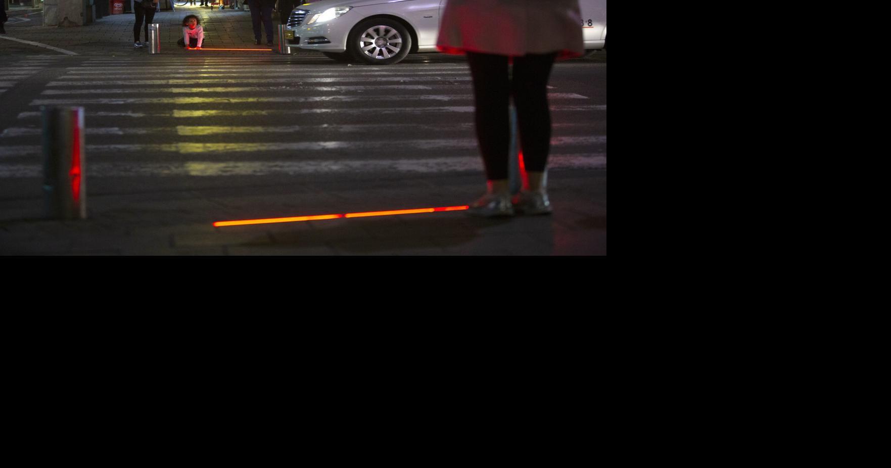 Israel deploys ‘zombie lights’ at crosswalks for phone-obsessed pedestrians