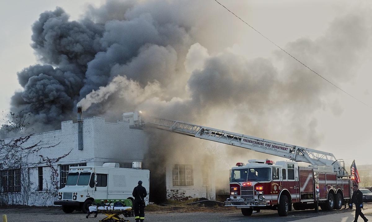Firefighters respond to a fire at the old downtown ice plant