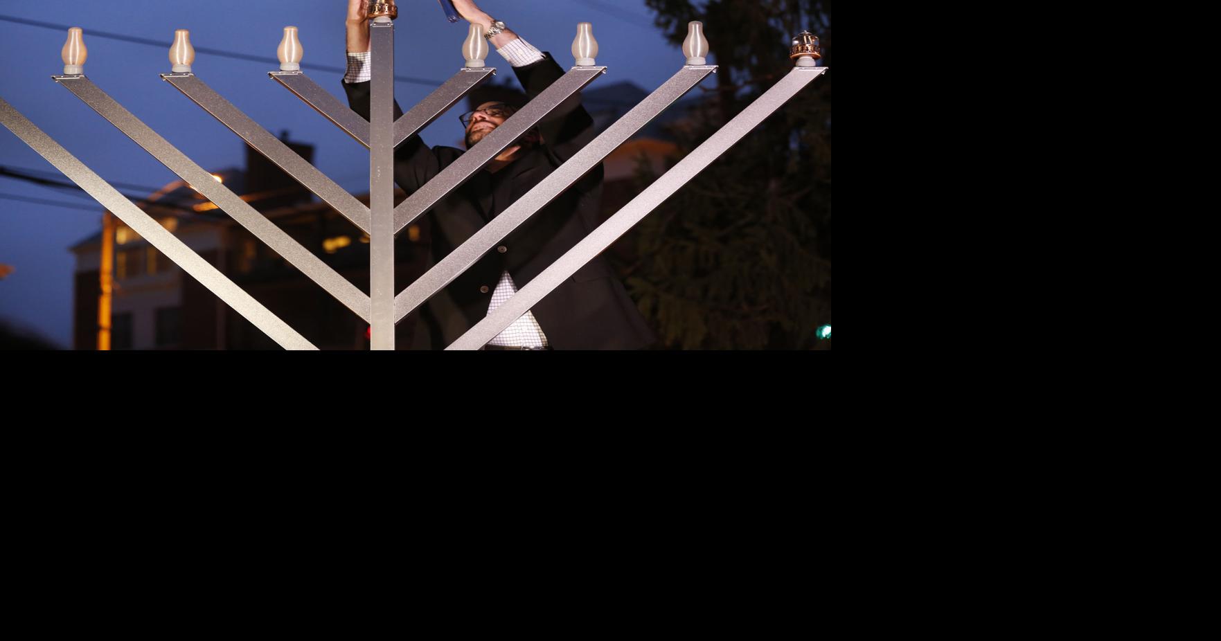 Menorah >> Lighting the flame of Hanukkah