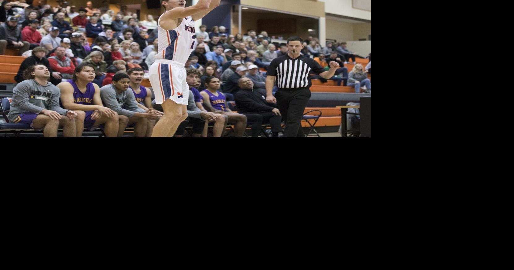 Midland men's basketball earns first conference win