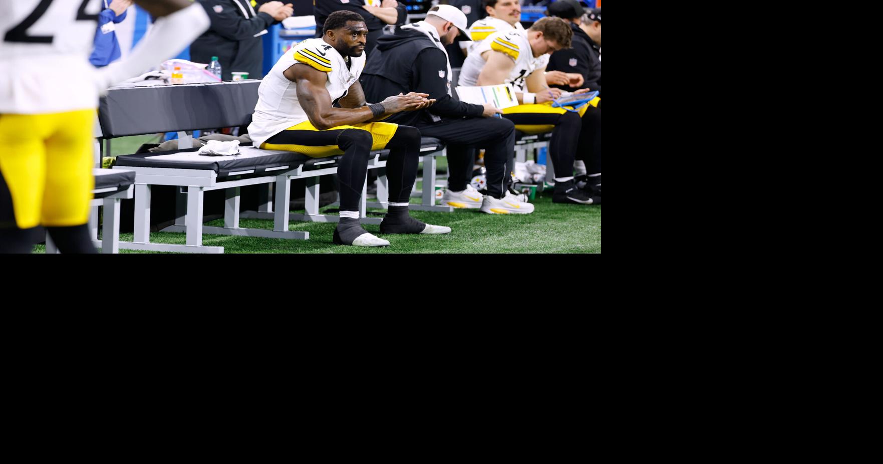 Steelers receiver DK Metcalf swipes at Lions fan leaning over railing ...