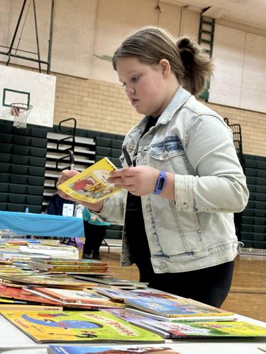 Ruby Moore helping with book fair. | | gazetterecord.com