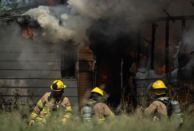 Scio neighbor saves 2 from house fire