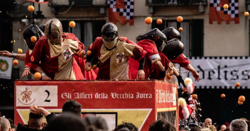 Watch epic food fight in Italy as people hurl oranges at each other