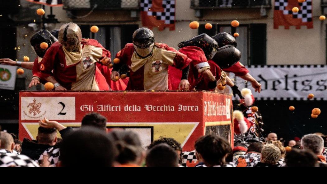Watch epic food fight in Italy as people hurl oranges at each other ...