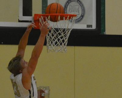 A little fun with slam dunks in Philomath's basketball rout