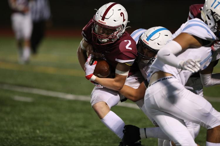 Prep football: Worsch carries Spartans past Raiders