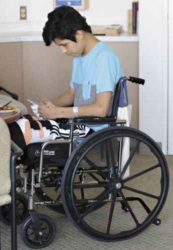 Meningitis survivor pushes through the pain