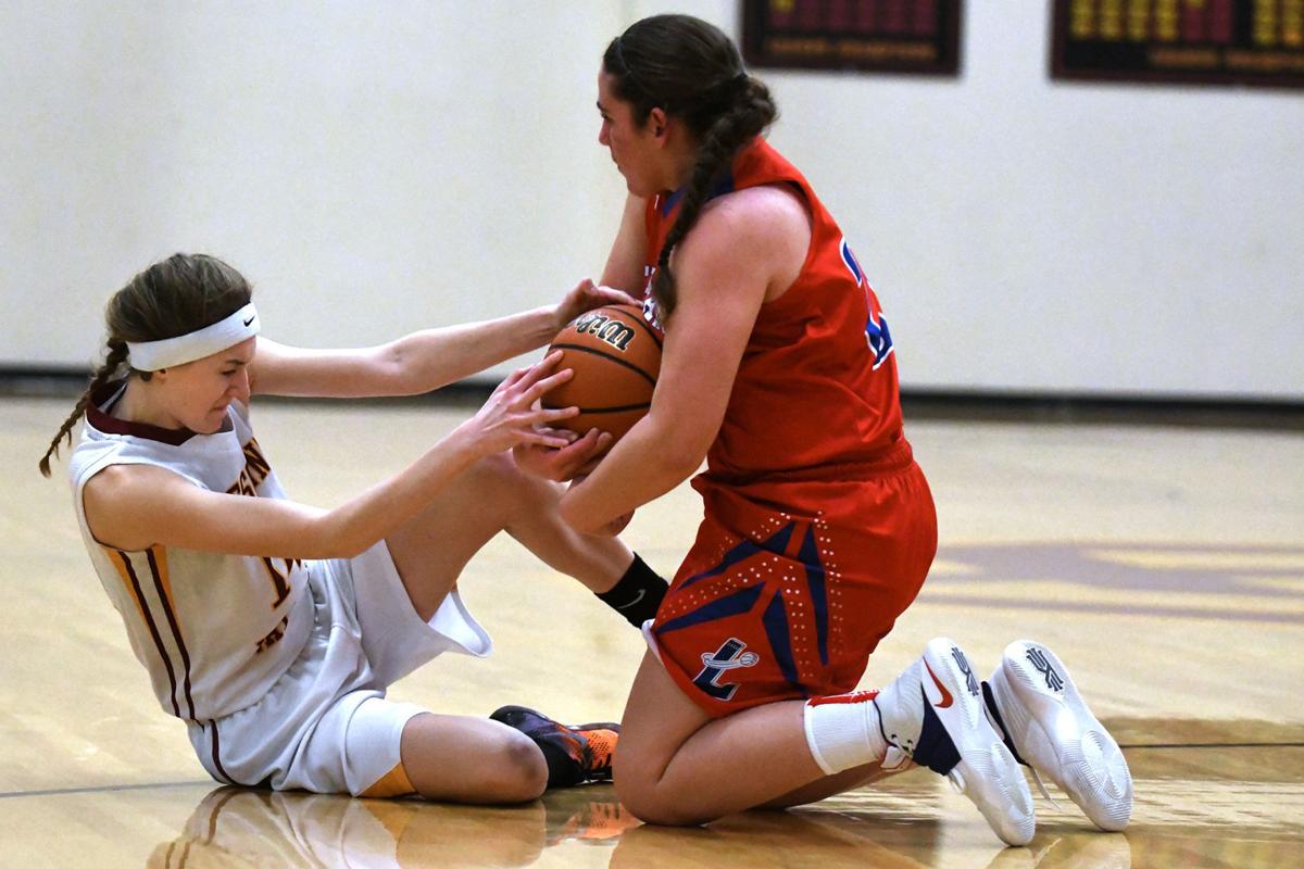 Prep girls basketball: Turnovers, rebounding catch up with Raiders ...