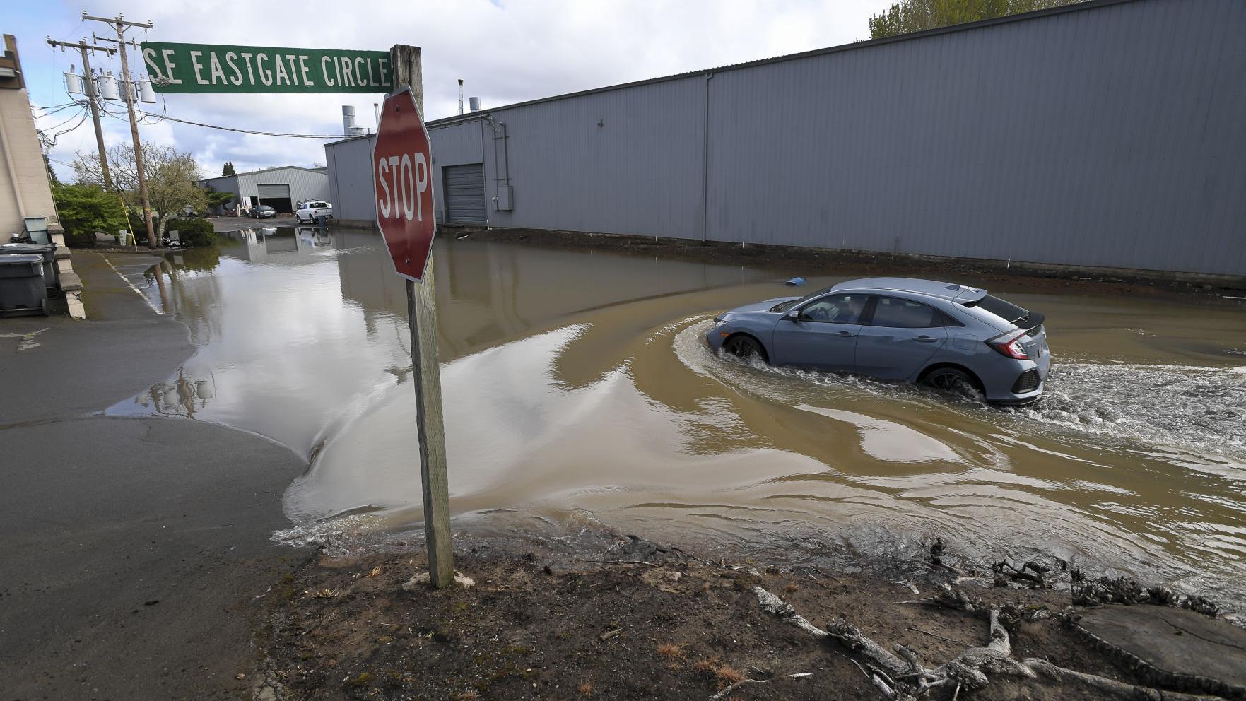 As the waters recede, flooding cleanup begins