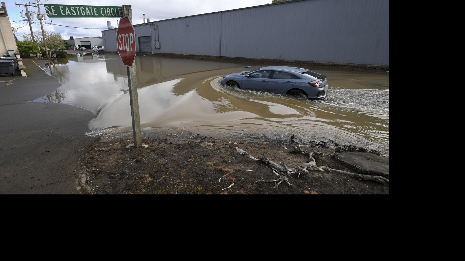 As the waters recede, flooding cleanup begins