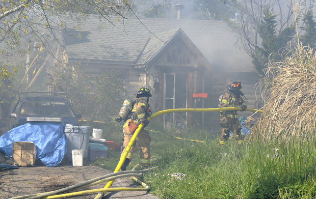 House fire north of OSU nearly spreads to neighboring residence