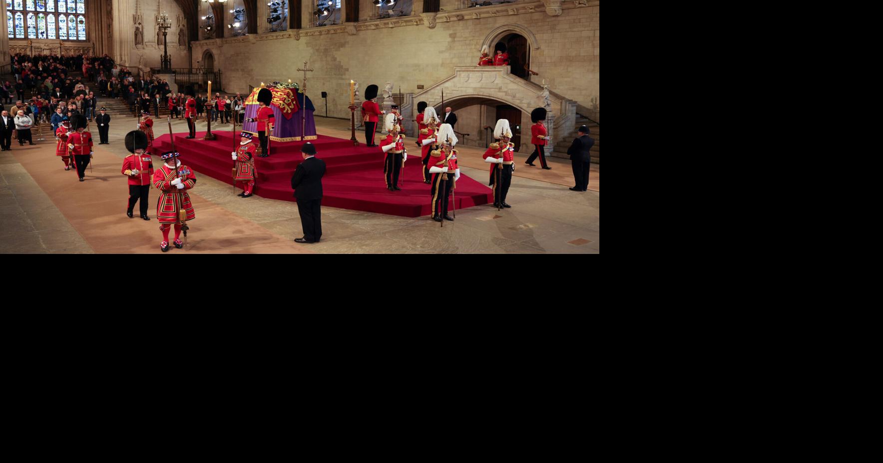 Live updates: Bidens pay their respects at queen's coffin