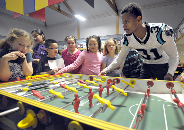 NFL players interact with kids at the Boys & Girls Club