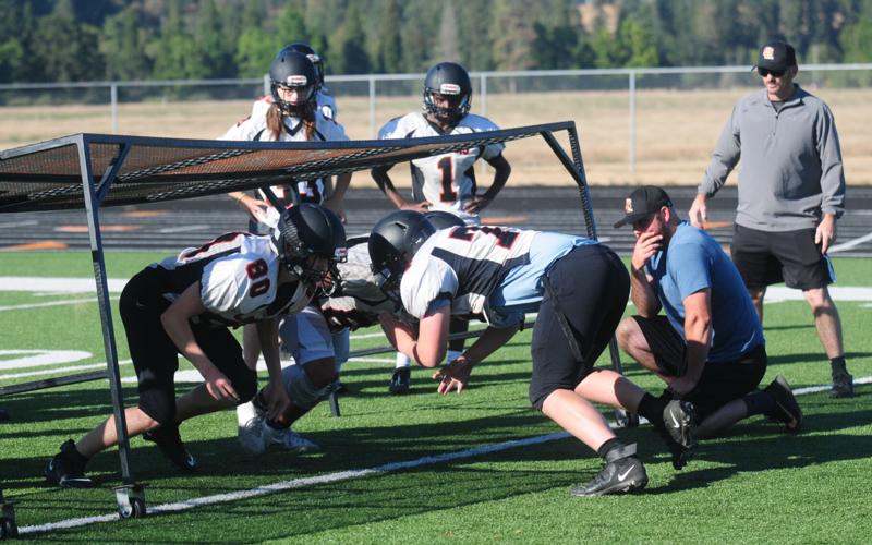 Prep football: New coach in Philomath, tradition continues in Scio