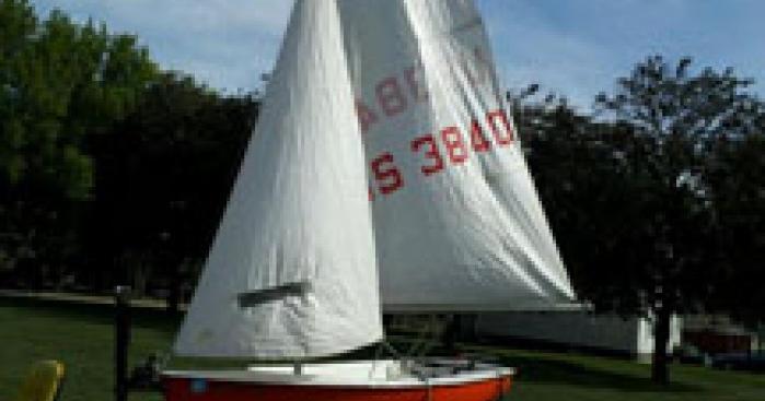 Flying Junior sailboat by Advance Sailboat Corp. Includes Spartan trailer.