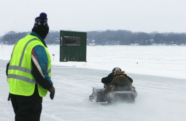 Snowmobiles run on Clear Lake