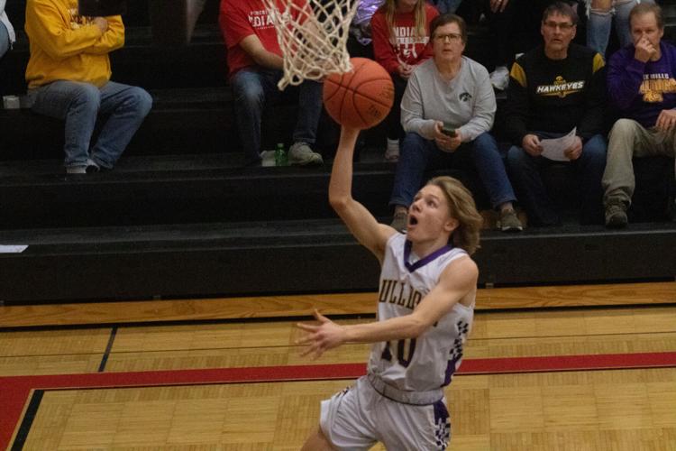 High School Boys Basketball: Lake Mills holds off Garrigan, advances to ...