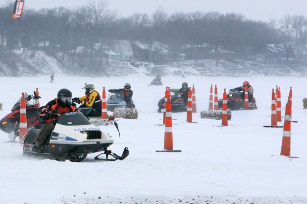 Snowmobiles run on Clear Lake