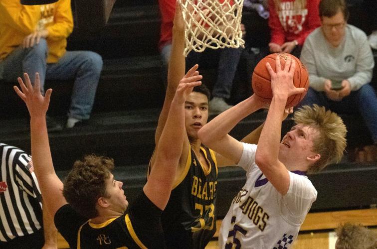 High School Boys Basketball: Lake Mills holds off Garrigan, advances to ...