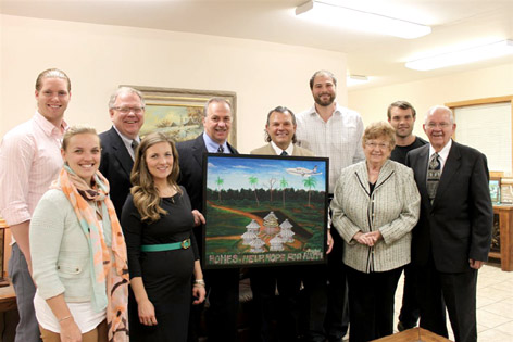 Sukup receives painting from Haiti